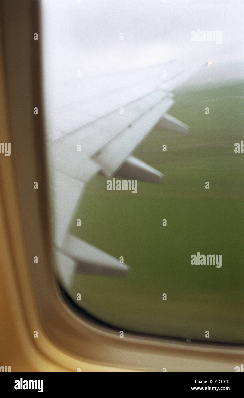 view of wing from plane window landing movement Stock Photo - Alamy