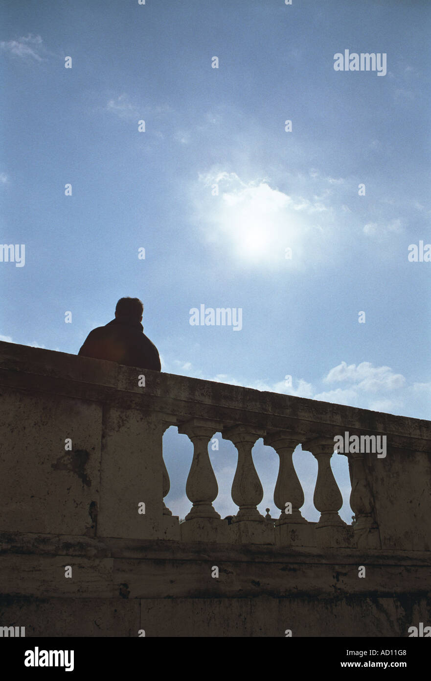 one single person standing by wall Stock Photo - Alamy