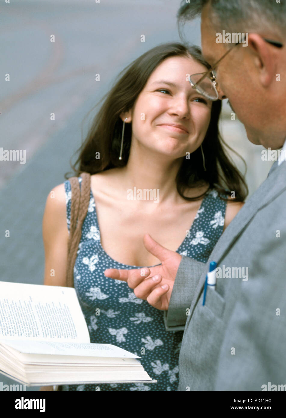 teacher talking with student Stock Photo - Alamy