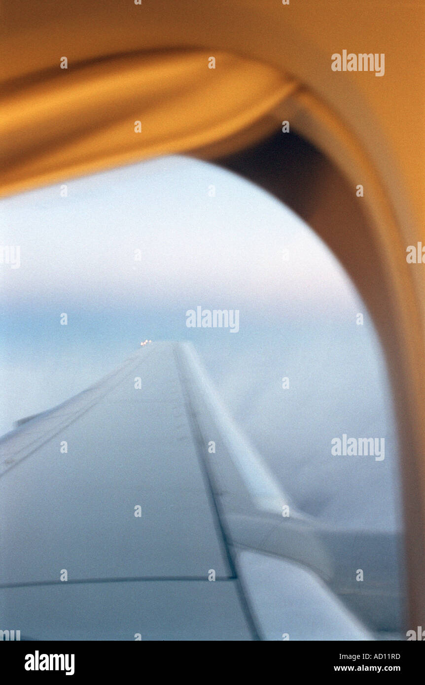 view of engine and dramatic sky from plane window Stock Photo - Alamy