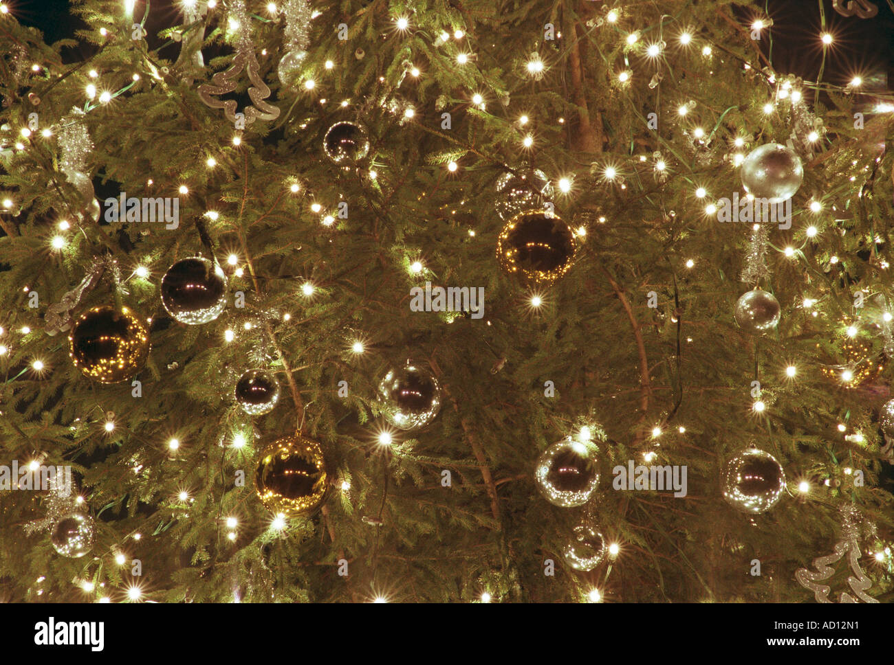 christmas tree with colourful lights at night Stock Photo - Alamy