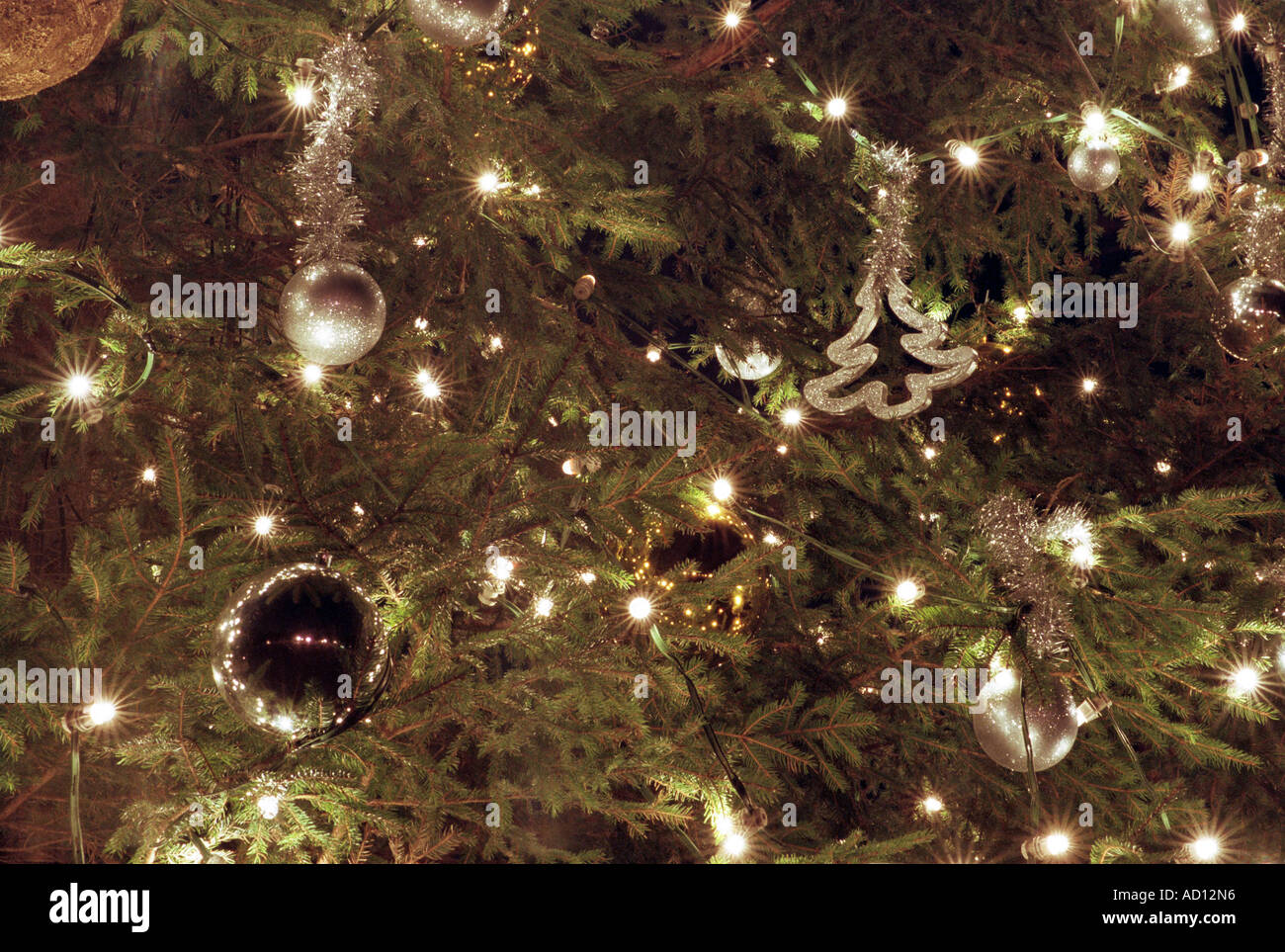 christmas tree with colourful lights at night Stock Photo - Alamy
