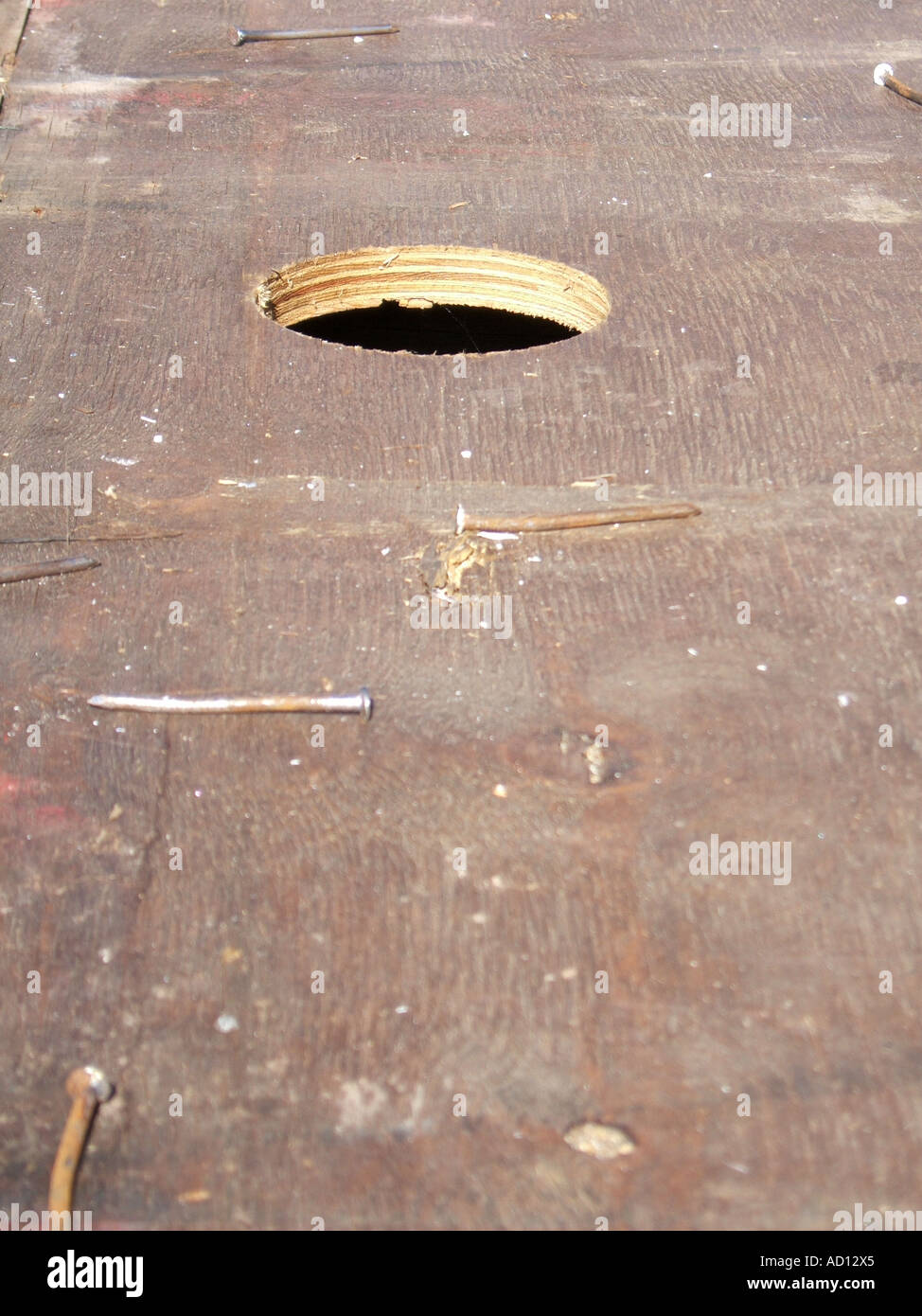 round hole in floor board Stock Photo - Alamy