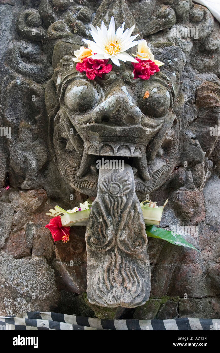 Rock carving of mythical Hindu demon Batubuan Bali Indonesia Stock ...