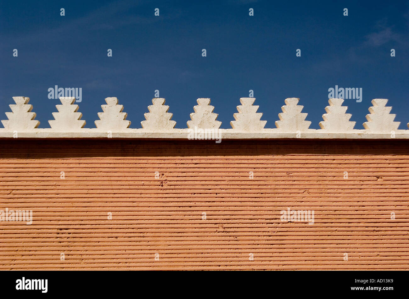 Castellations at the top of brick wall in Marrakech, Morocco Stock ...