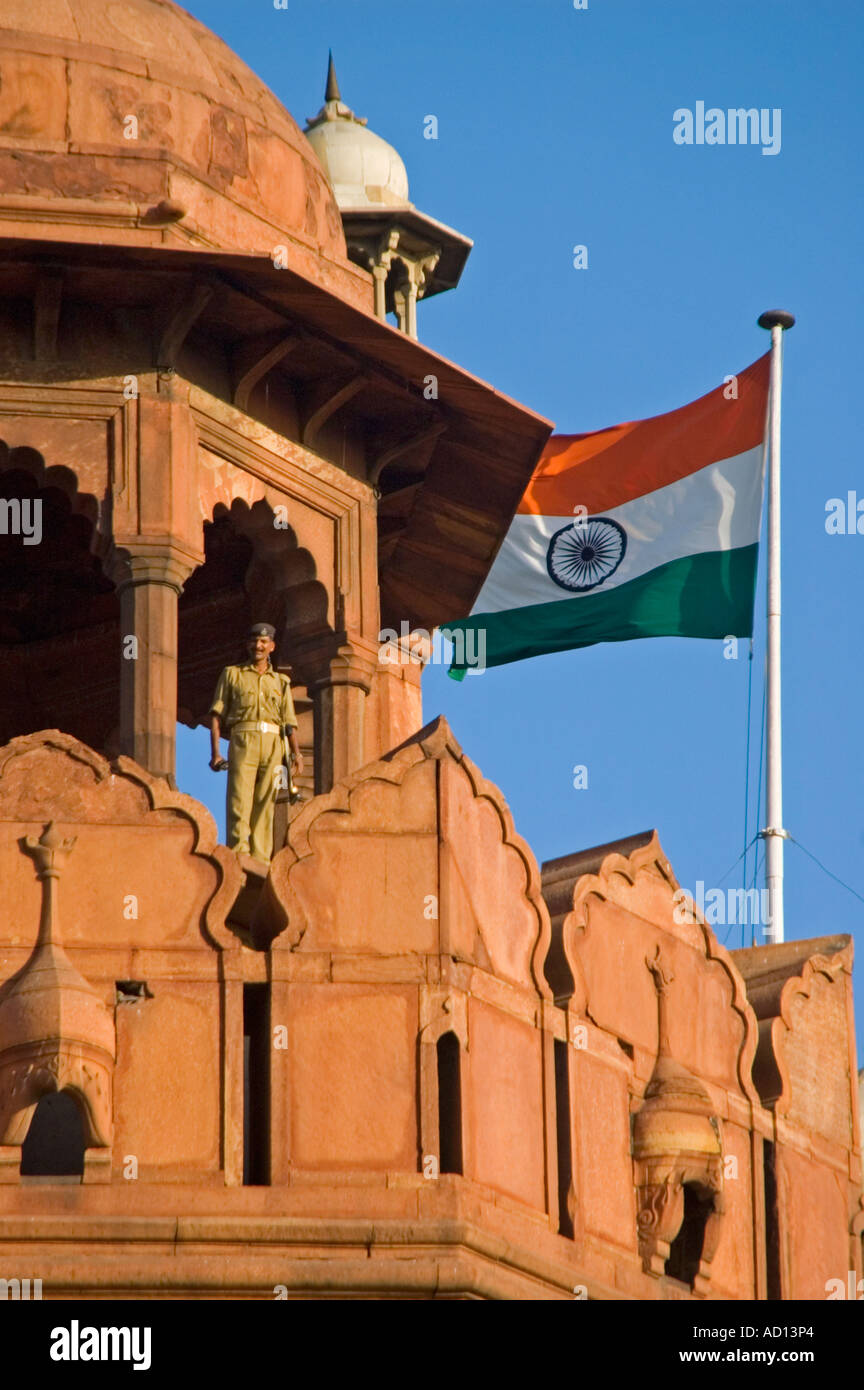 Vertical close up of a watchtower with a soldier keeping guard on the ...
