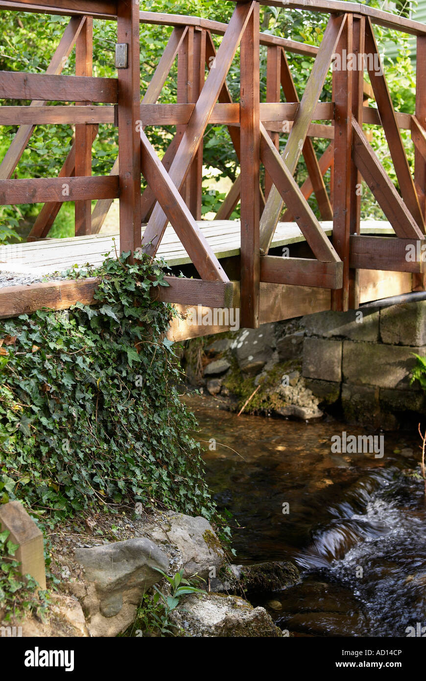 Wooden bridge over a small stream Stock Photo - Alamy