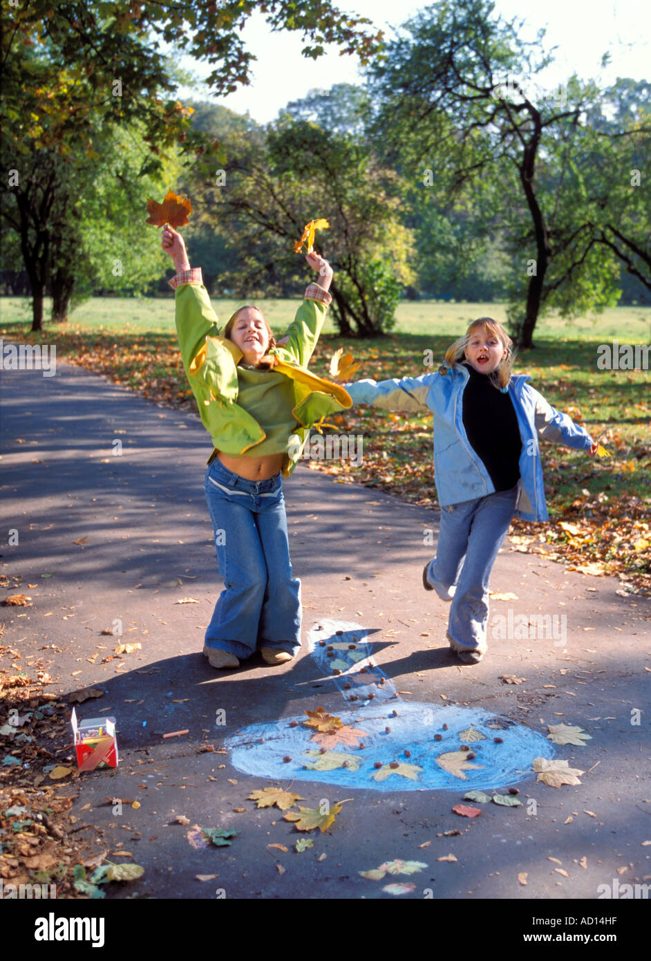 Children play outdoors jumping over hi-res stock photography and images ...