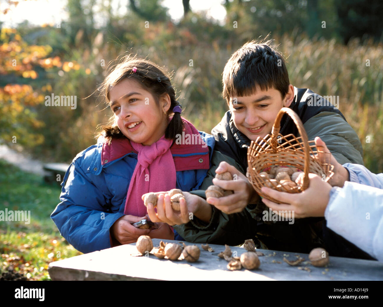 Boy and girl playing with nuts Stock Photo - Alamy