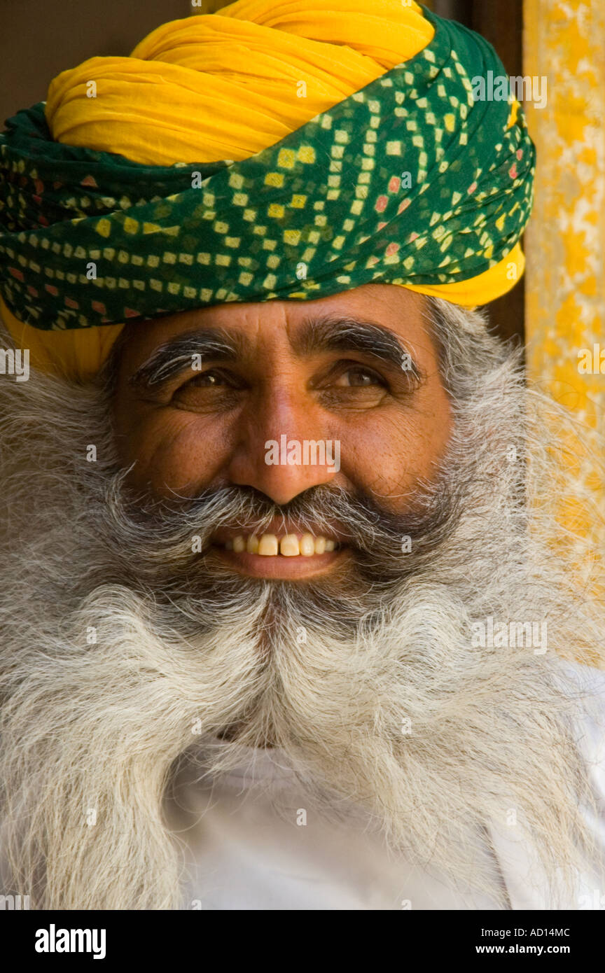 Vertical portrait of a traditionally dressed elderly Indian gentleman ...