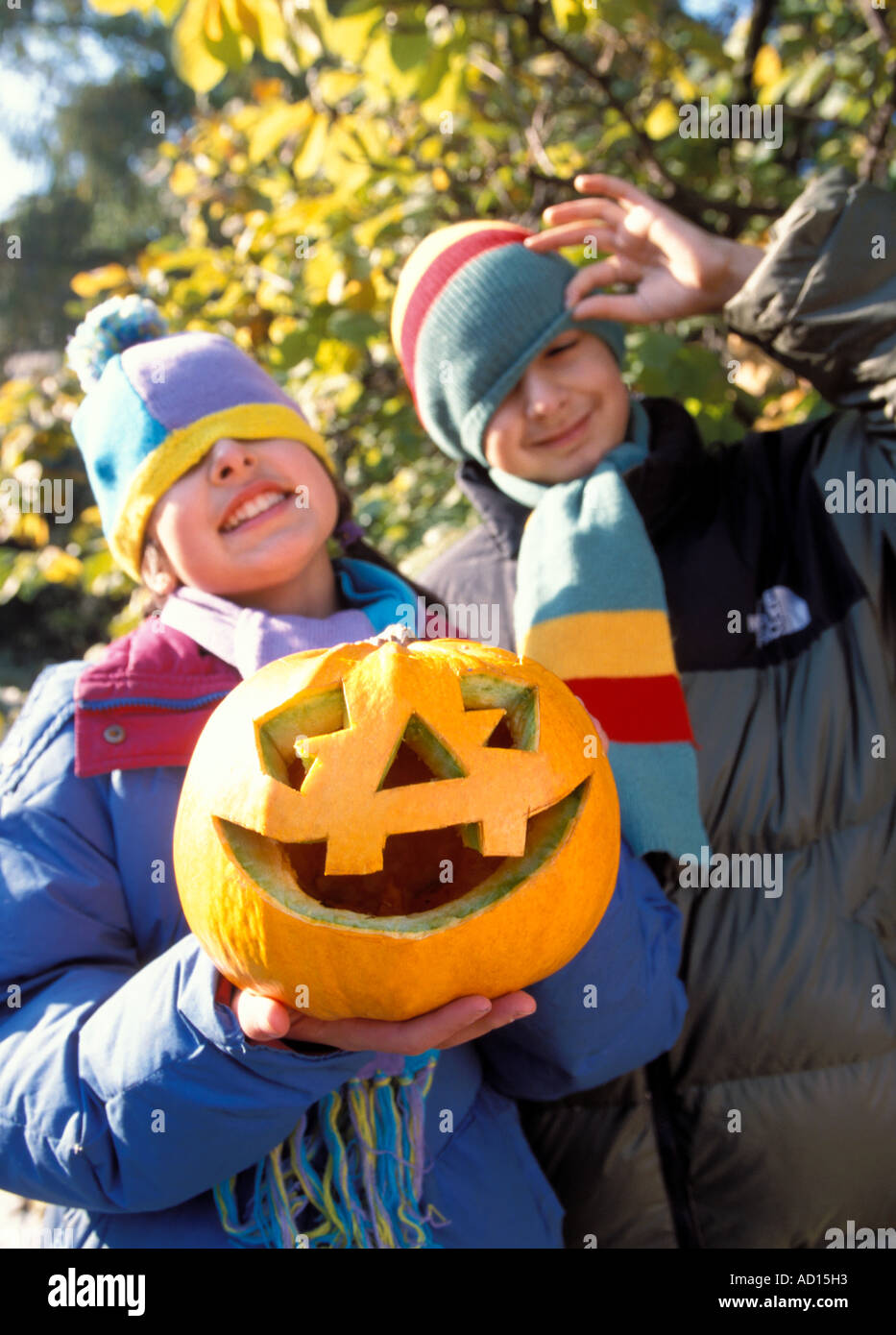 boy and girl with halloween pumpkin Stock Photo - Alamy
