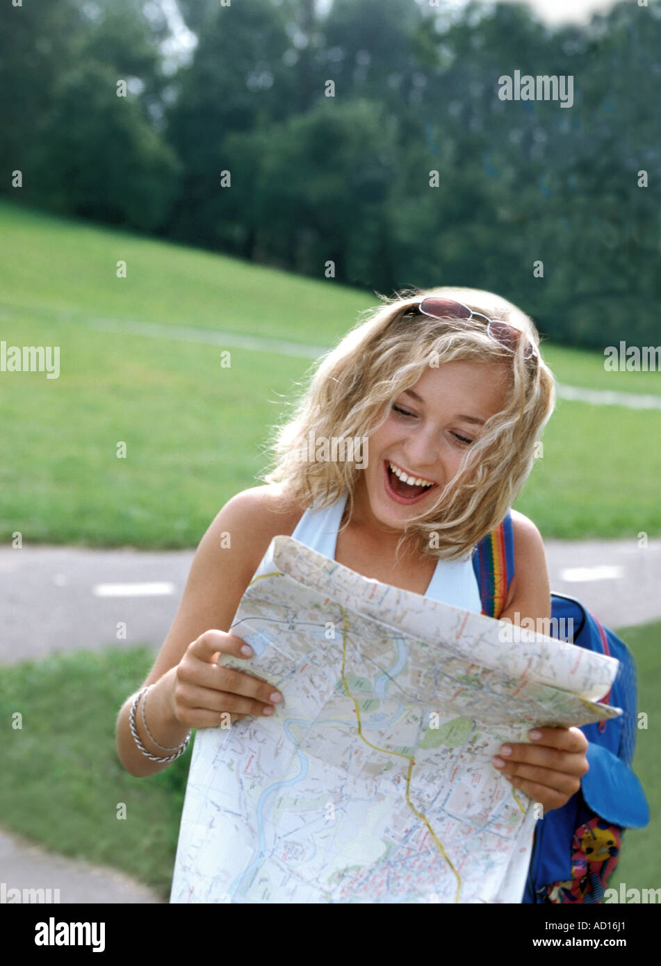 woman reading map laughing Stock Photo - Alamy