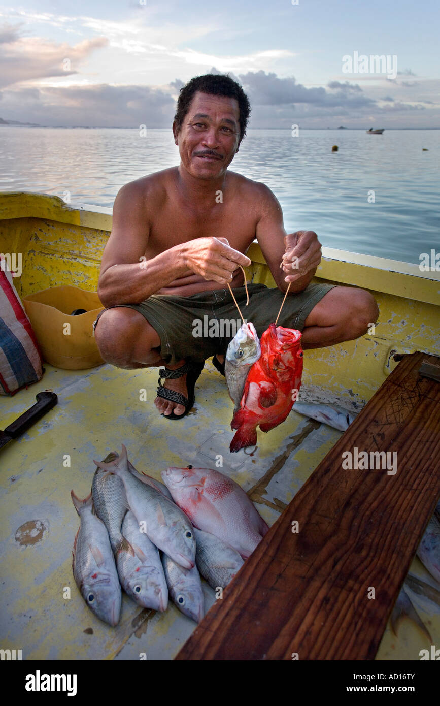 Fisherman on the island of La Digue, Seychelles Stock Photo - Alamy