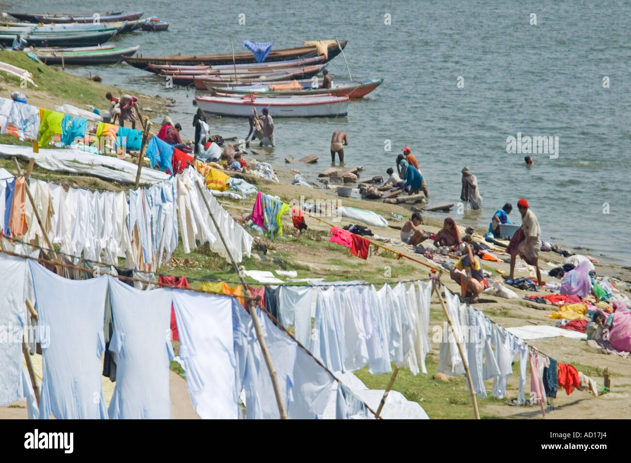 Horizontal portrait of Indian 'dhobi wallahs' washing laundry close to ...