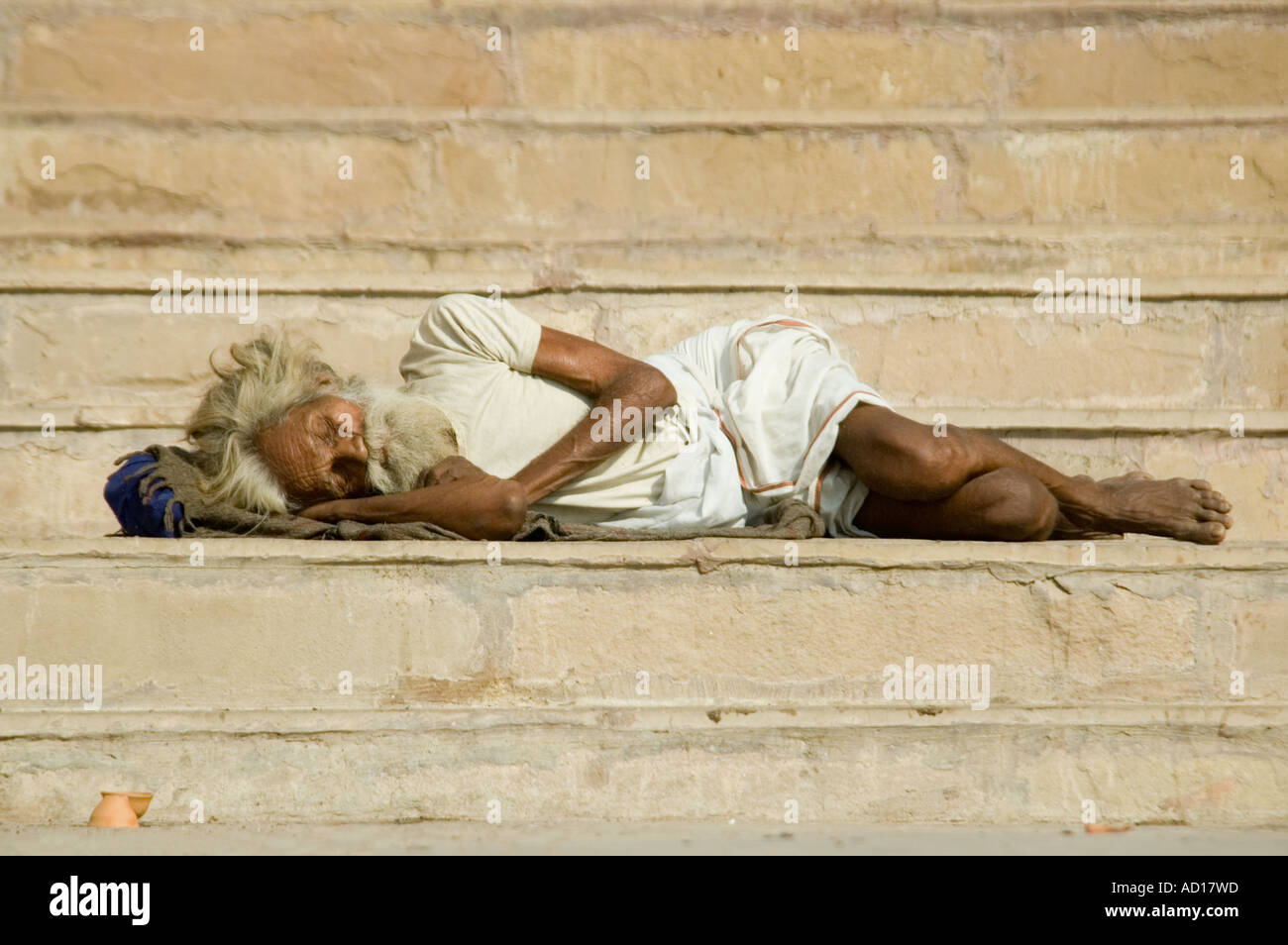 Horizontal close up portrait of a desperately poor thin old man ...