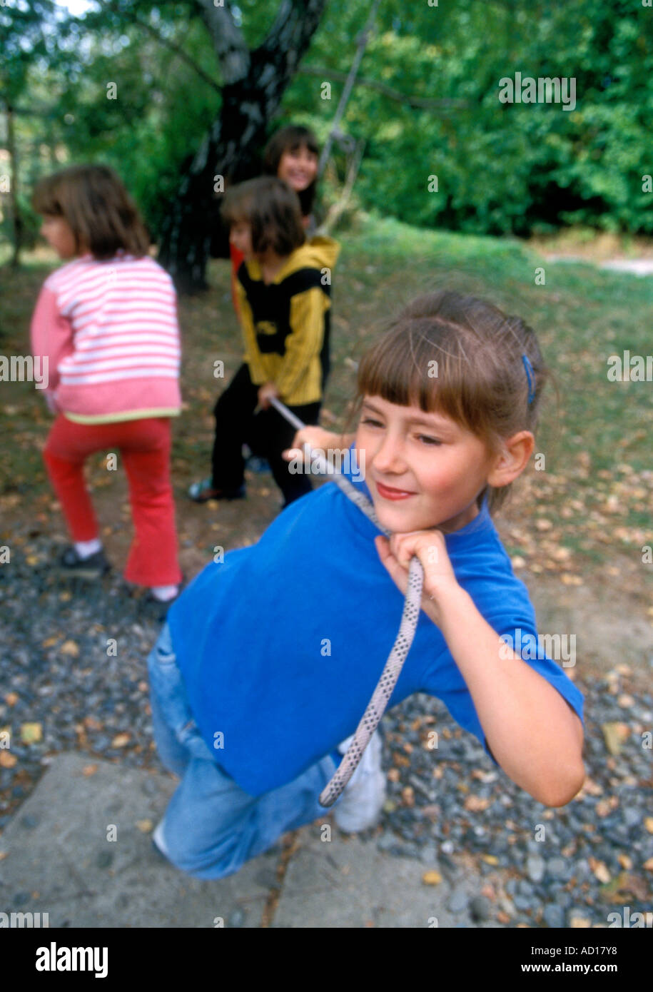 Children setting up rope for play Stock Photo - Alamy