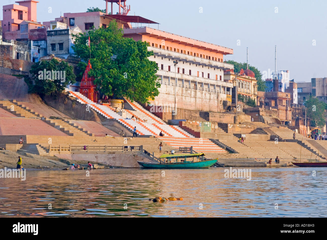 A wide angle view of a shrouded dead body floating down the river ...