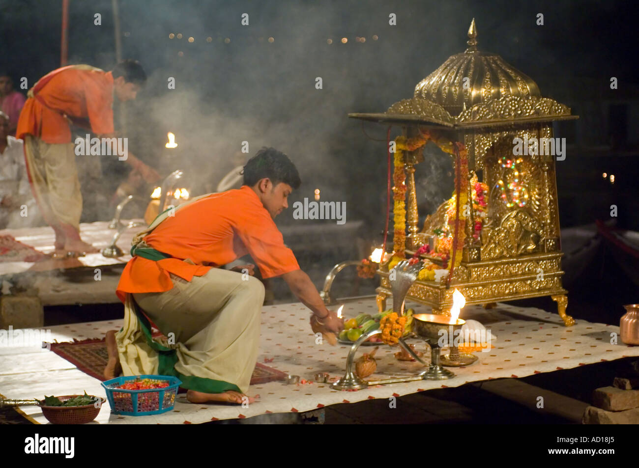 A view of aarti (prayers) being performed by young priests (pujaris) at ...
