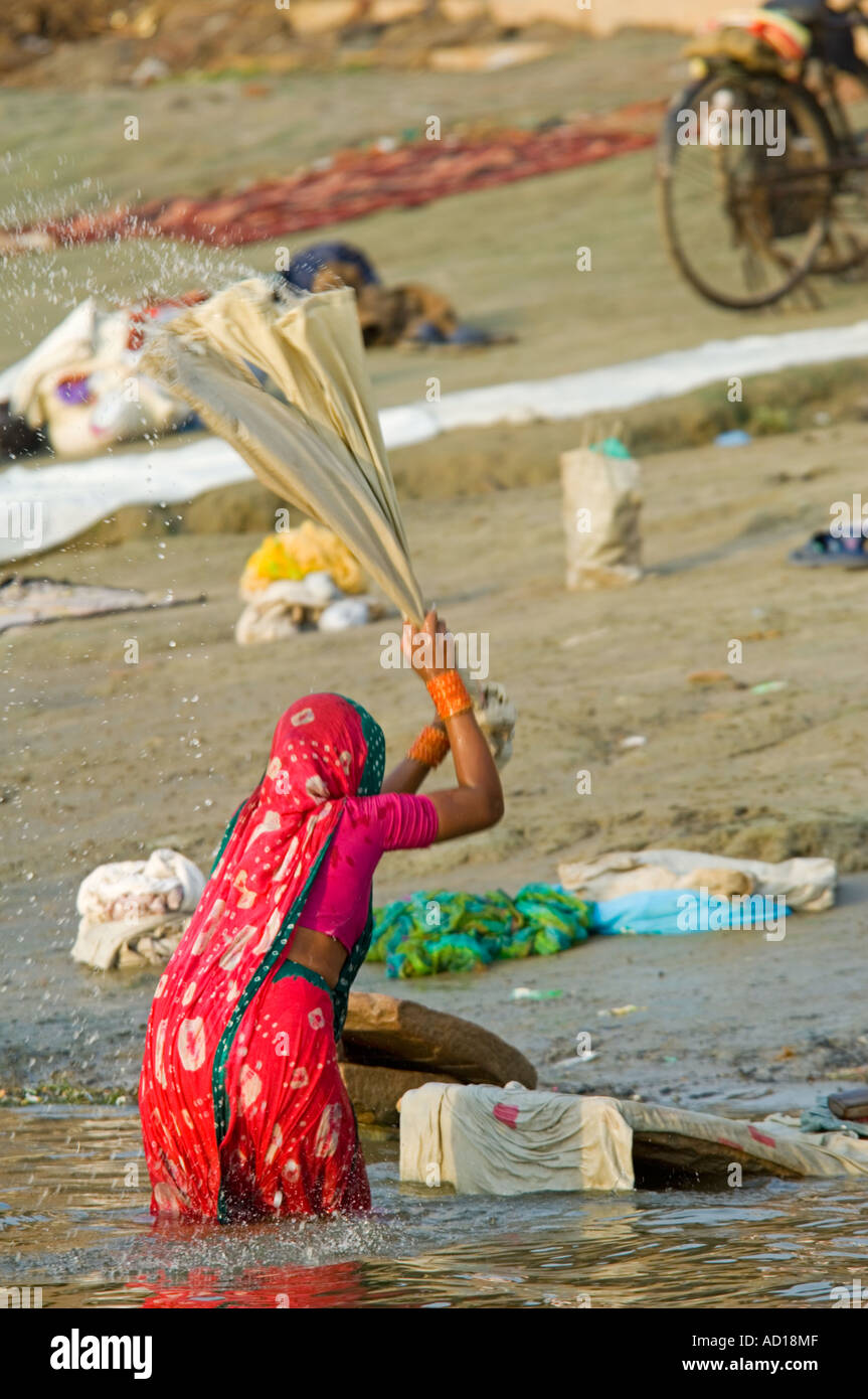 Indian girl washing clothes hi-res stock photography and images - Alamy