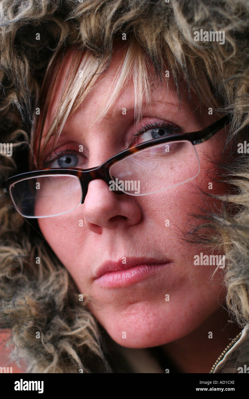 "30 year old model poses for shots wearing a large fur hood Stock Photo ...
