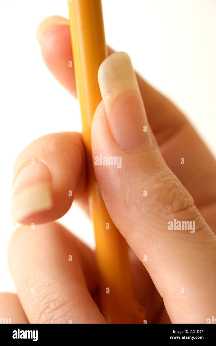 Hand holding pencil Stock Photo - Alamy