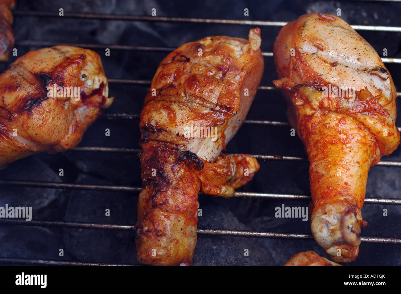 chicken cooking on the barbecue Stock Photo - Alamy