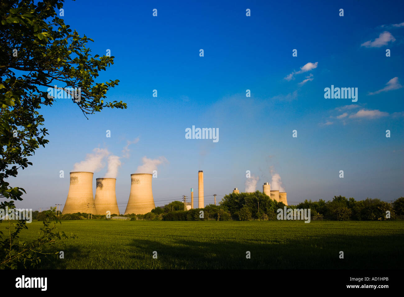 Power station cooling towers in countryside Stock Photo - Alamy