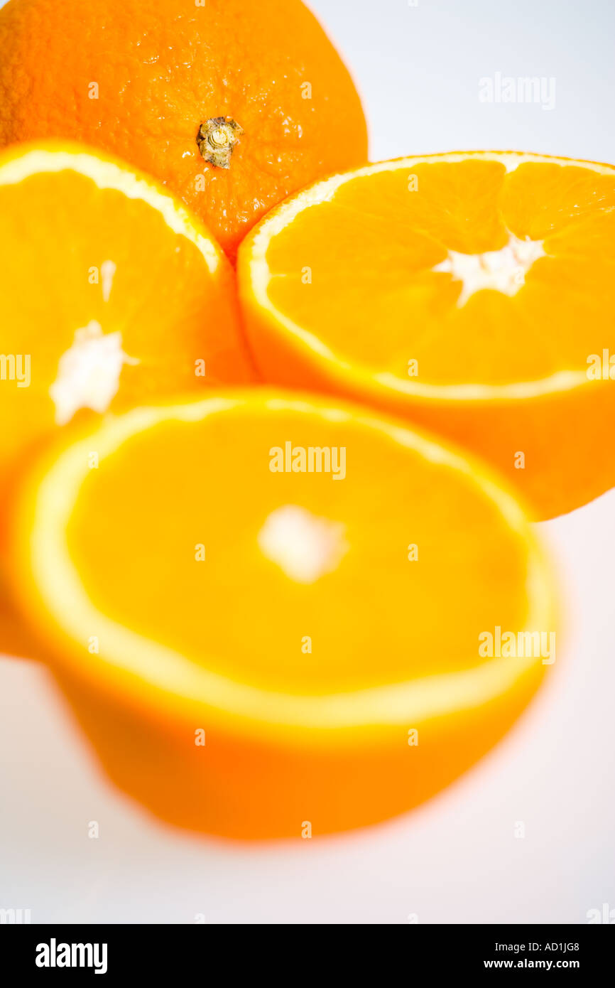 whole and half Oranges on white background Stock Photo - Alamy
