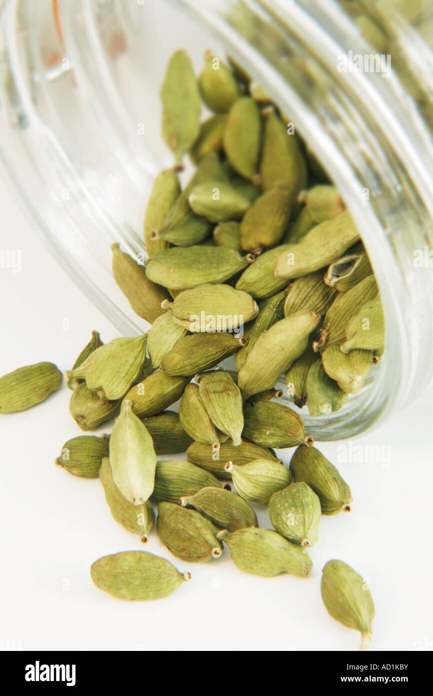 Green Cardamom Pods spilling from Storage Jar Stock Photo - Alamy