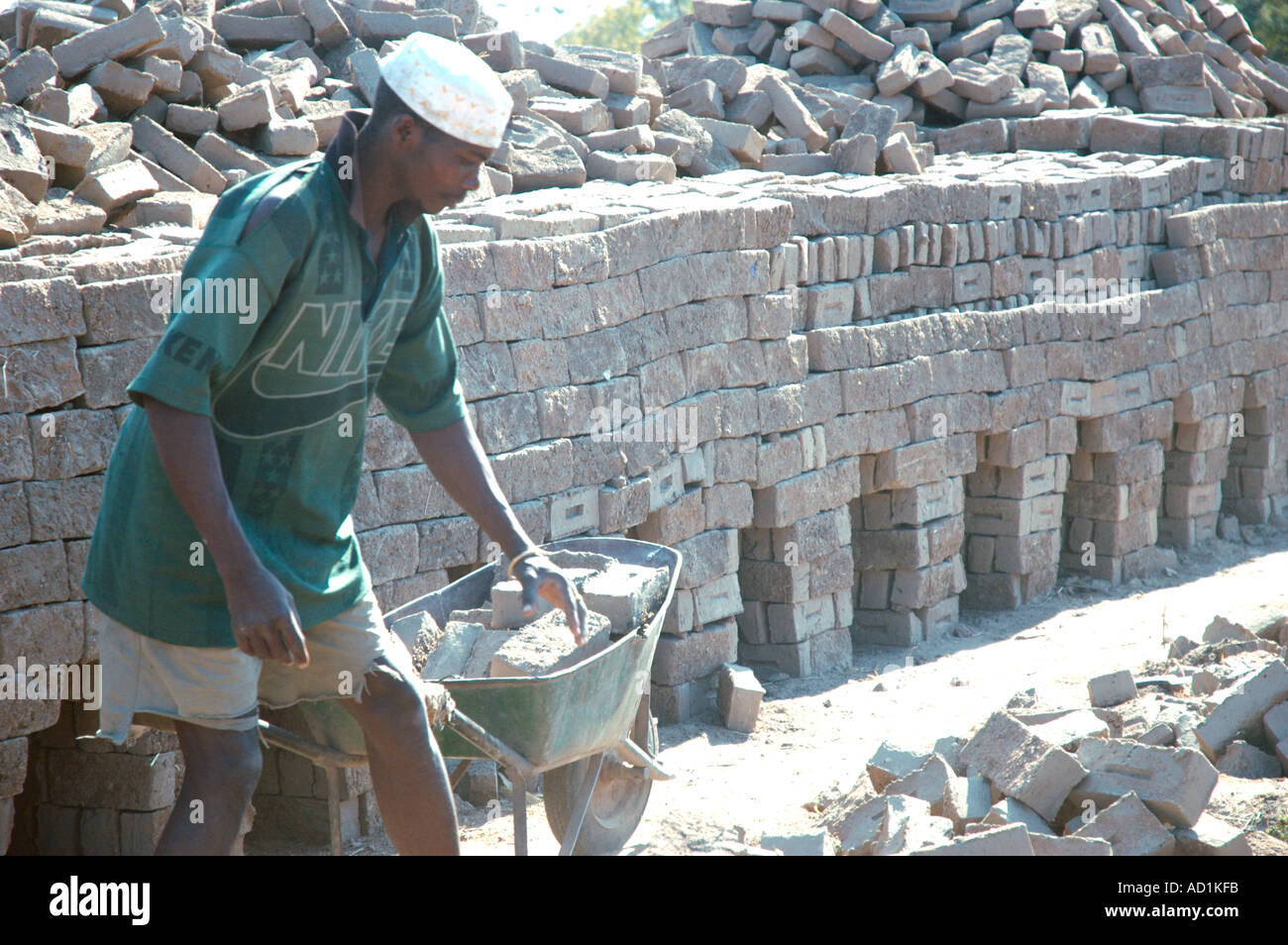 Muslim man making bricks in outdoor kiln in Mozambique Africa Stock ...