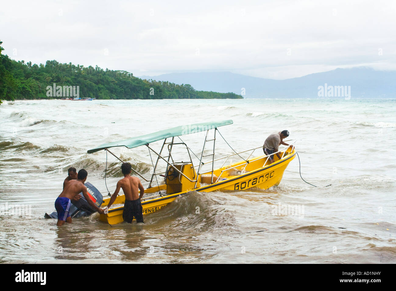 Saving a flooded boat Stock Photo - Alamy