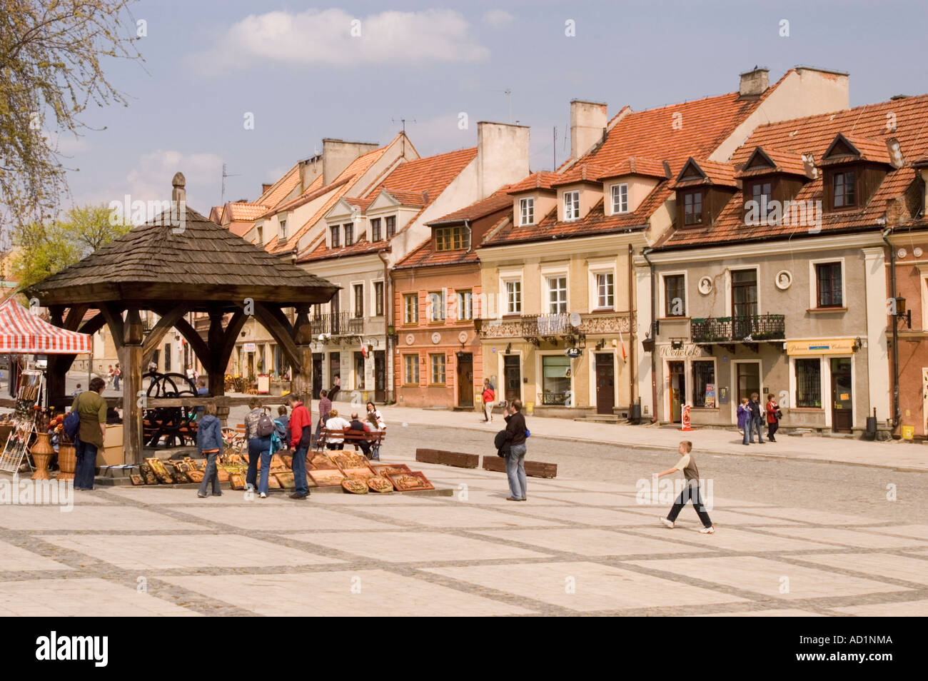 Old wooden wheel and row of heritage building on Market Square ...