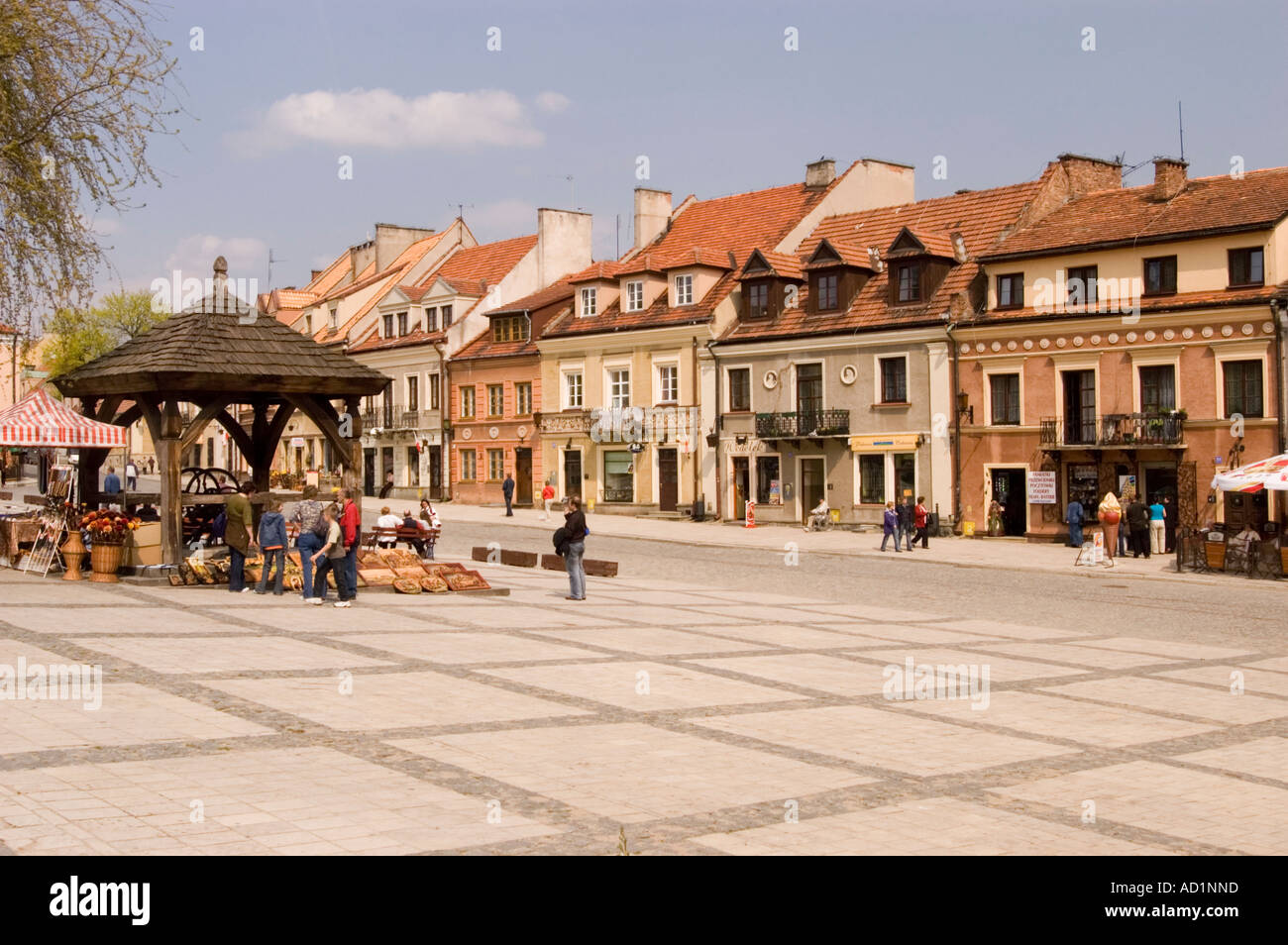 Old wooden wheel and row of heritage building on Market Square ...