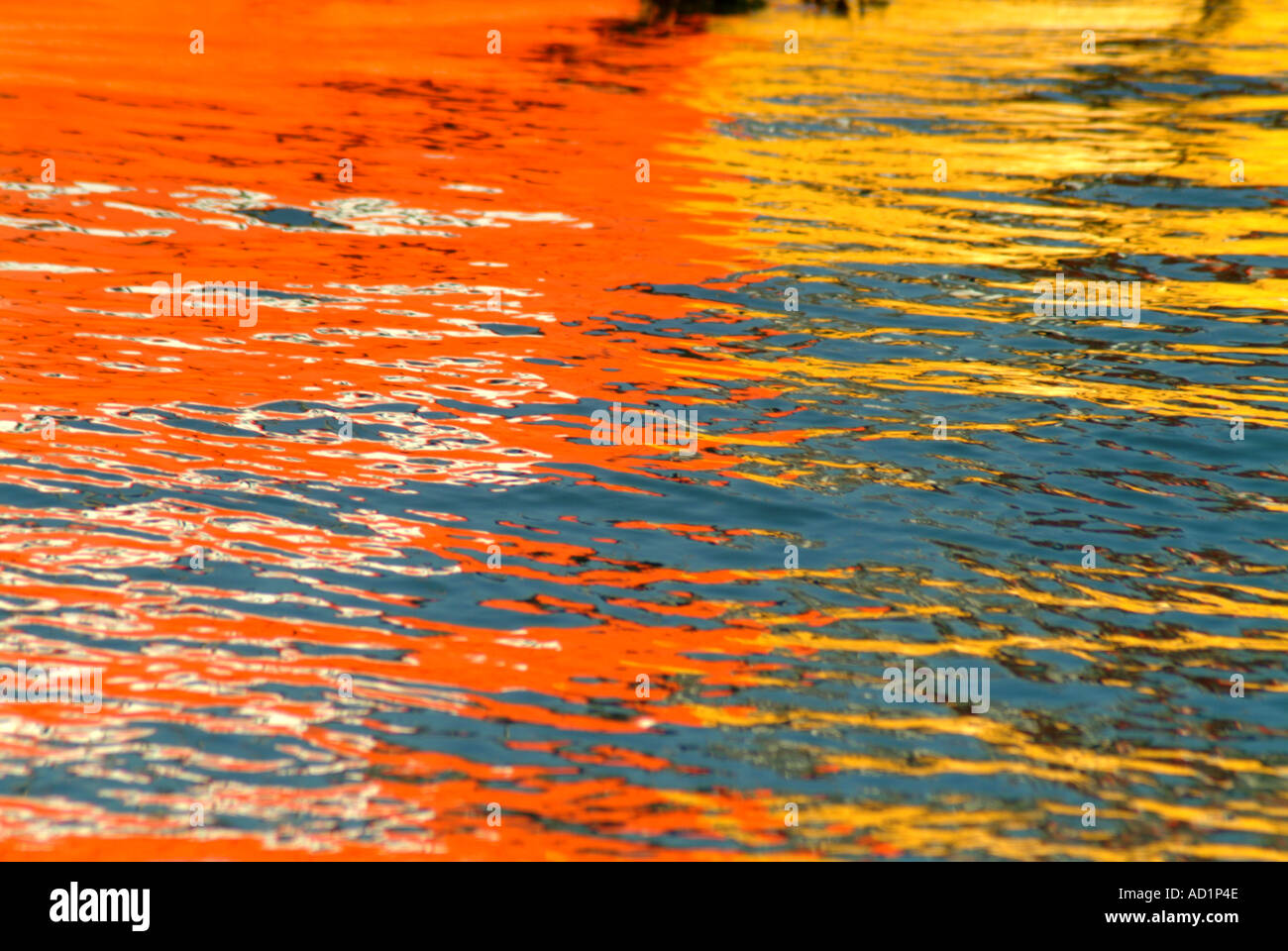Coloured reflections on water Stock Photo - Alamy