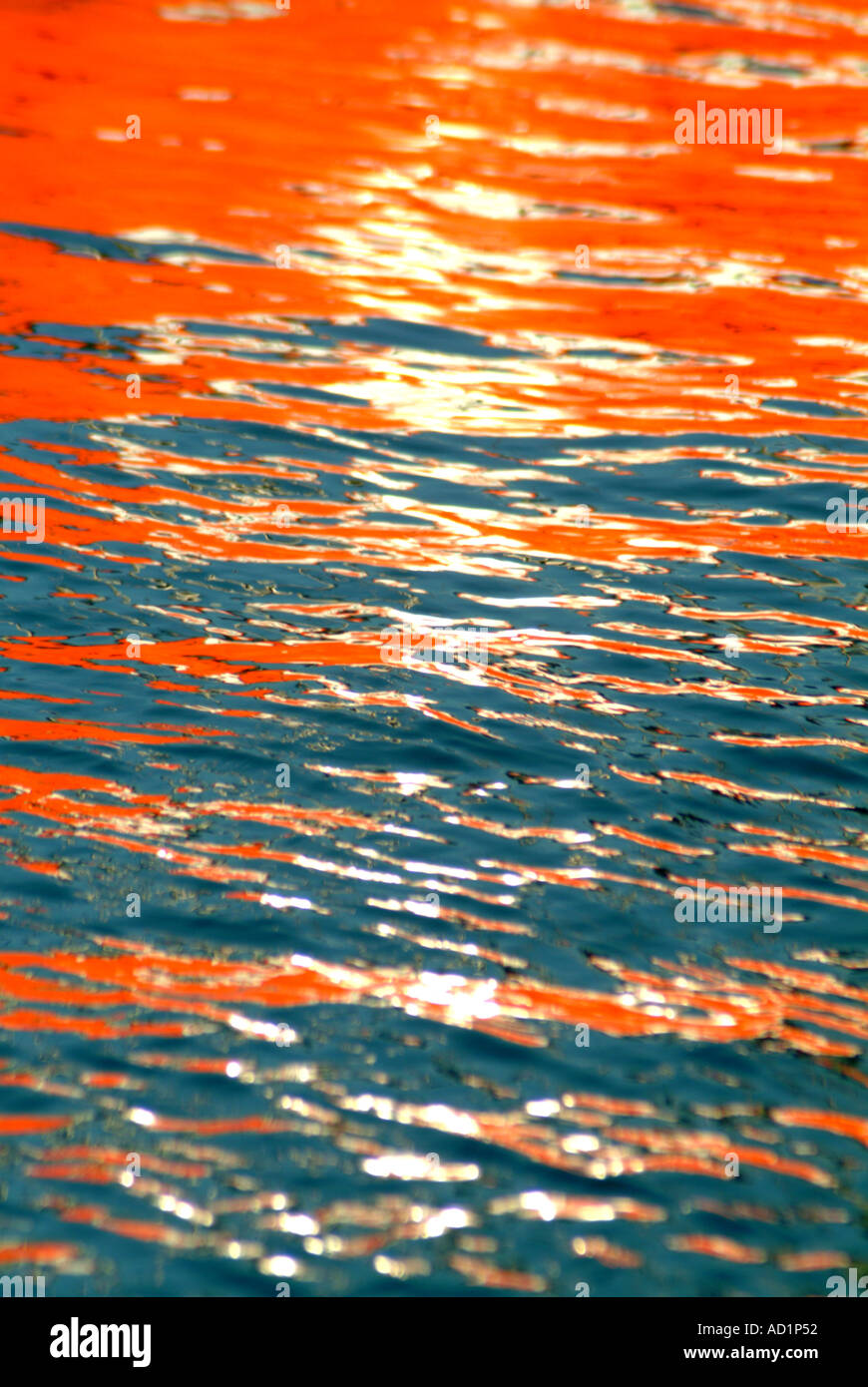 Coloured reflections on water Stock Photo - Alamy