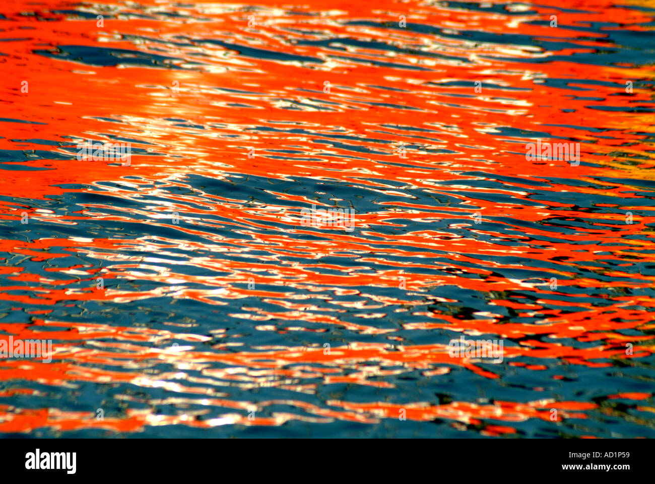 Coloured reflections on water Stock Photo - Alamy