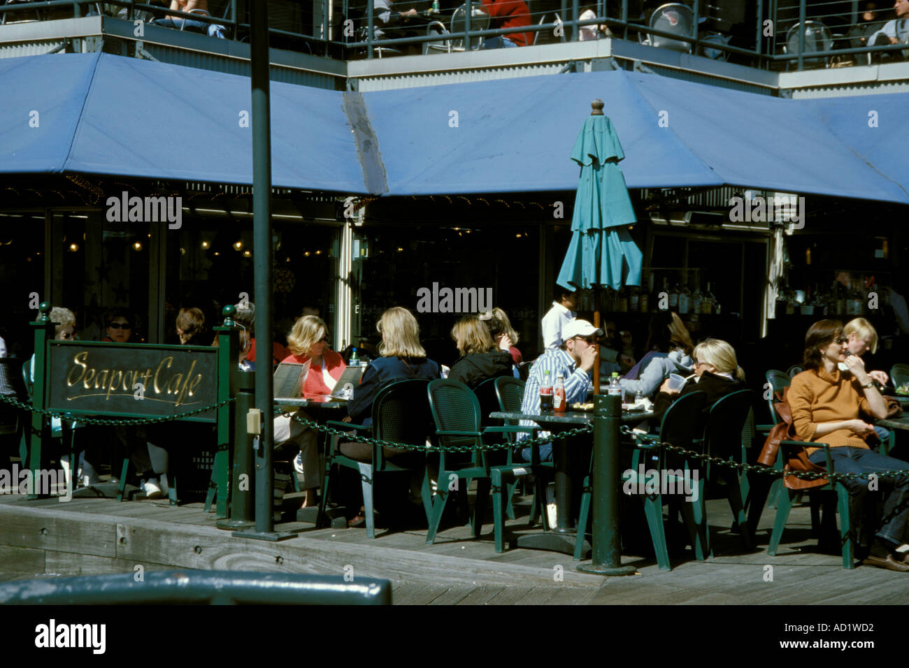 Tourists enjoying open air dining at the Seaport Cafe Pier 17 South ...