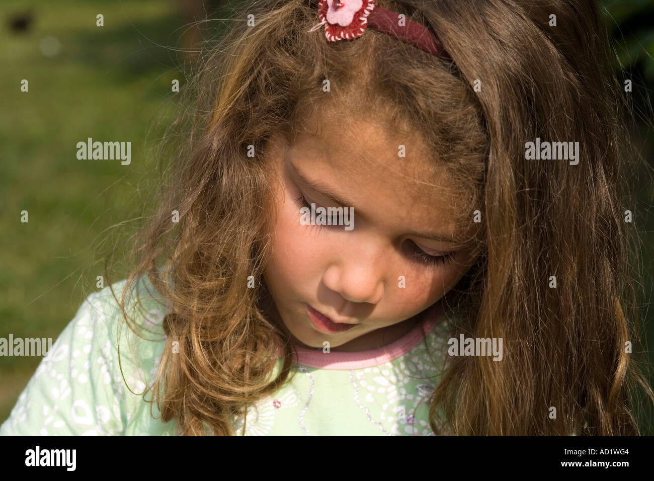little girl seriously embarassed and depressed Stock Photo - Alamy