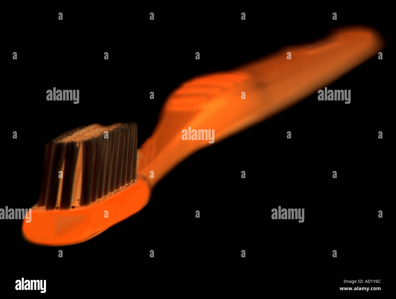 Orange and black graphic toothbrush Stock Photo - Alamy