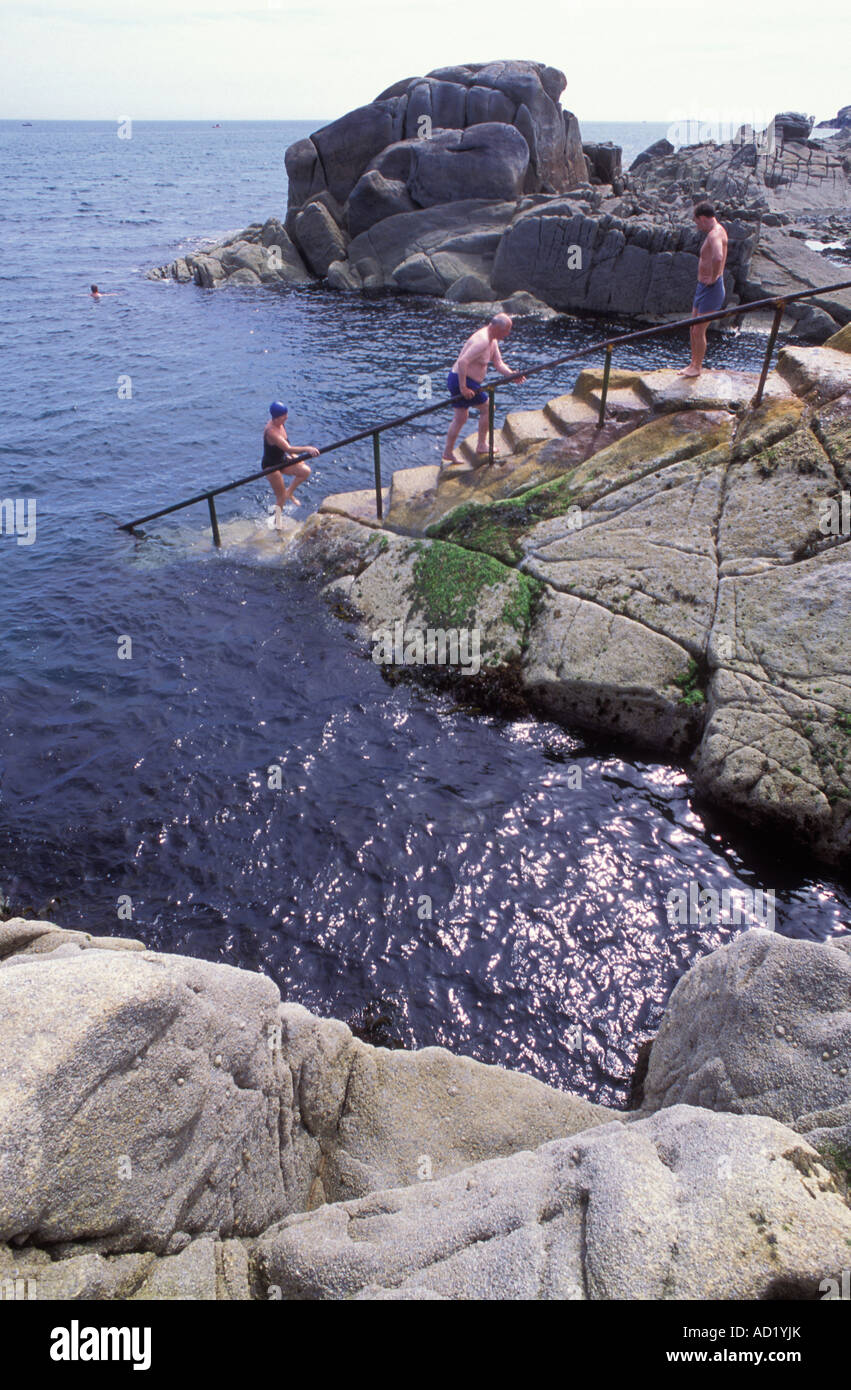 People bathing at Forty Foot Bathing Place in Sandycove near Dublin ...