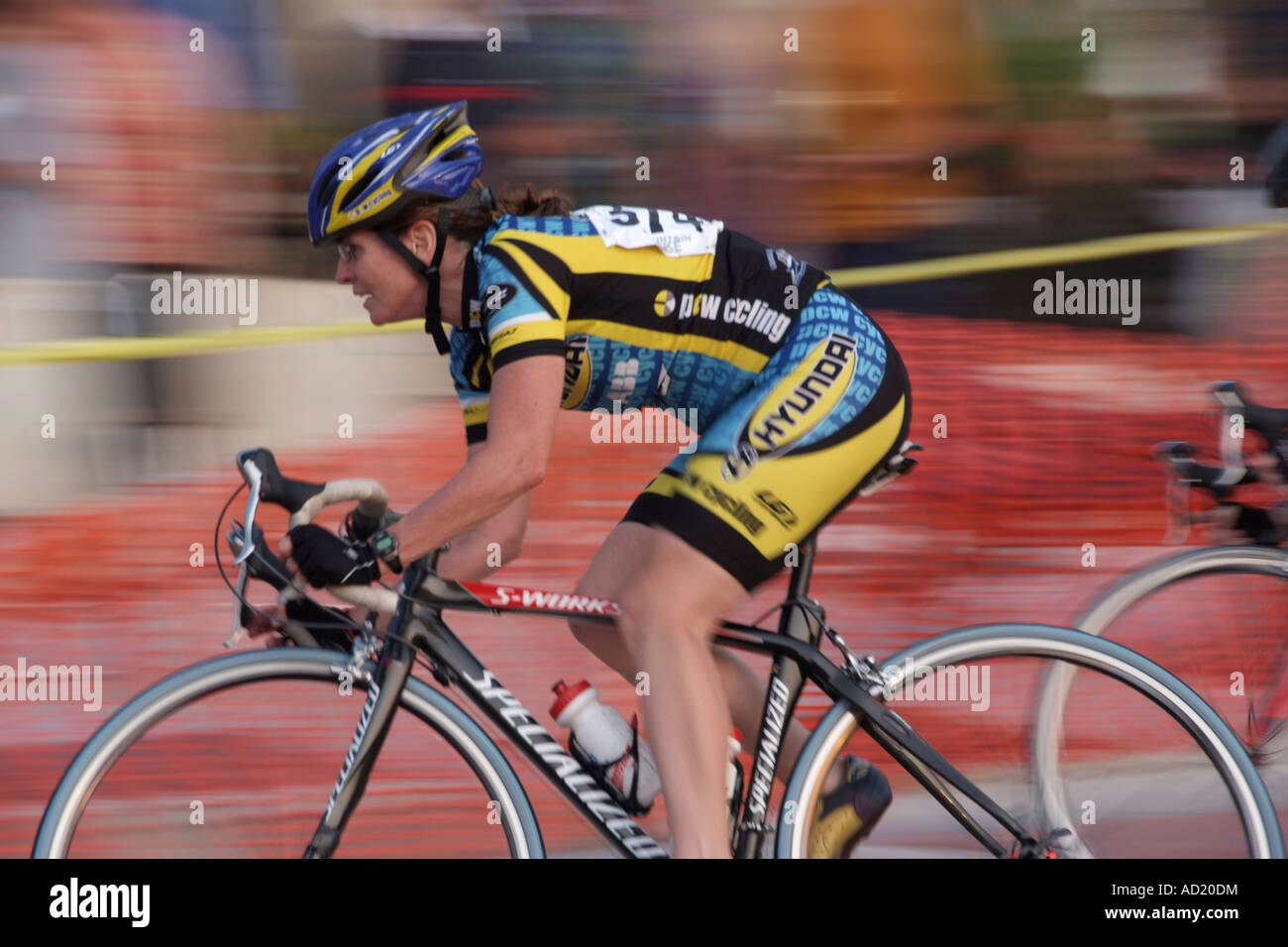 Fast moving bicyclist woman Stock Photo - Alamy