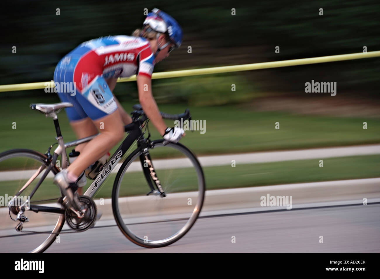 A young girl riding her bicycle extremely fast Stock Photo - Alamy