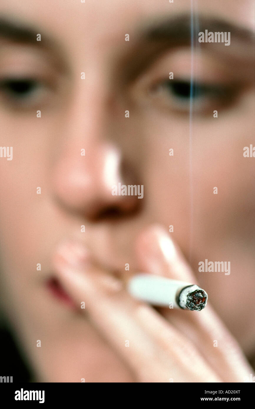Lady smoking a cigarette hi-res stock photography and images - Alamy
