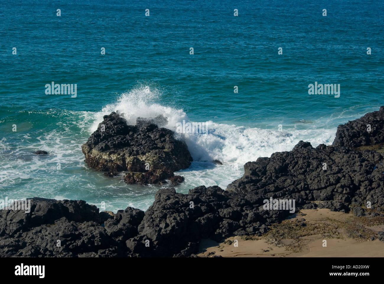 waves from the sea come splashing and crashing into the rocks Stock ...