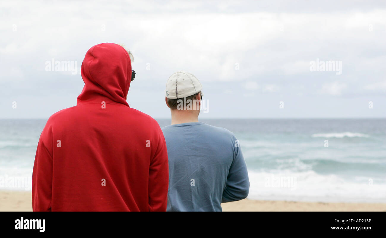 Two people check the surf in Australia Stock Photo - Alamy