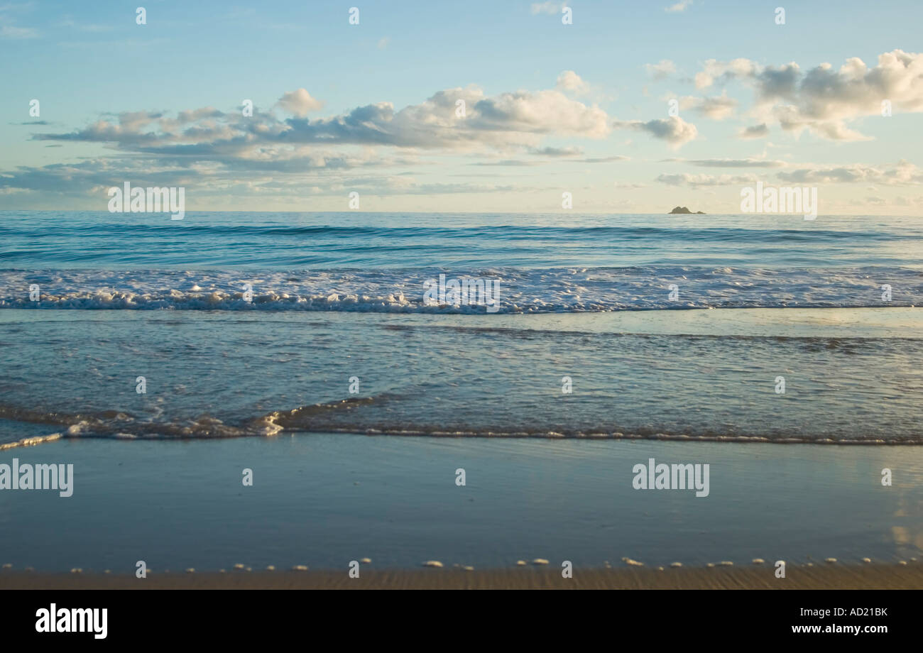 a nice beach scene with gentle waves reaching the sand Stock Photo - Alamy