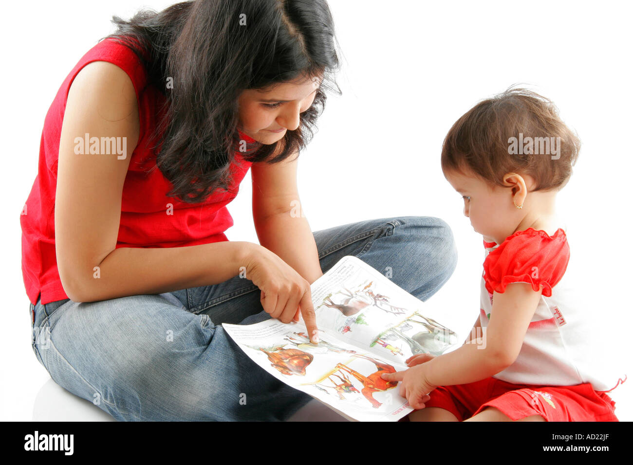 Indian mother teaching child hi-res stock photography and images - Alamy