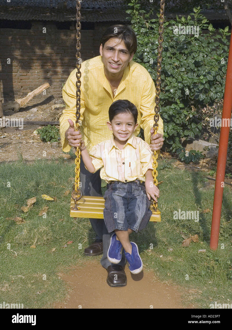 AHP72789 Family Religion Parsi Zorastrian Father and son entertaining ...