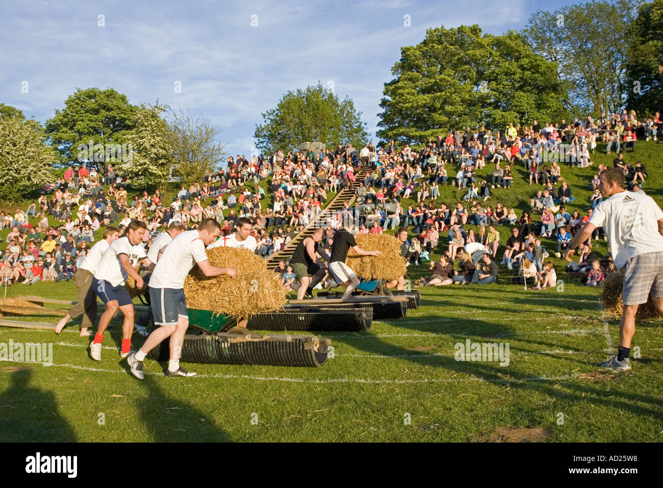 Straw bale wheelbarrow race at Cotswold Olimpicks Dovers Hill Cotswolds ...