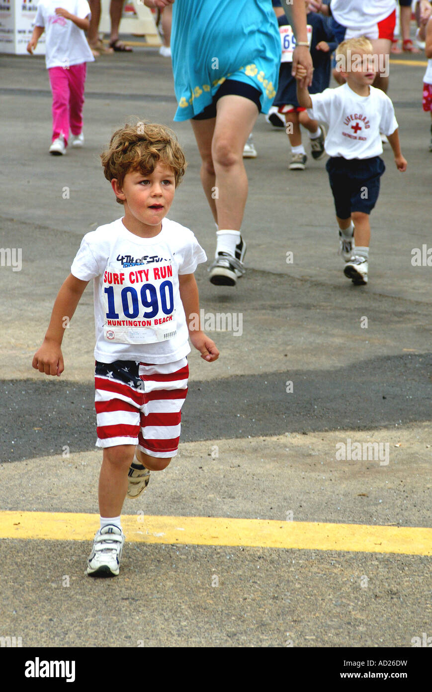 Parents and children run together in 5K race before start of 4th of ...